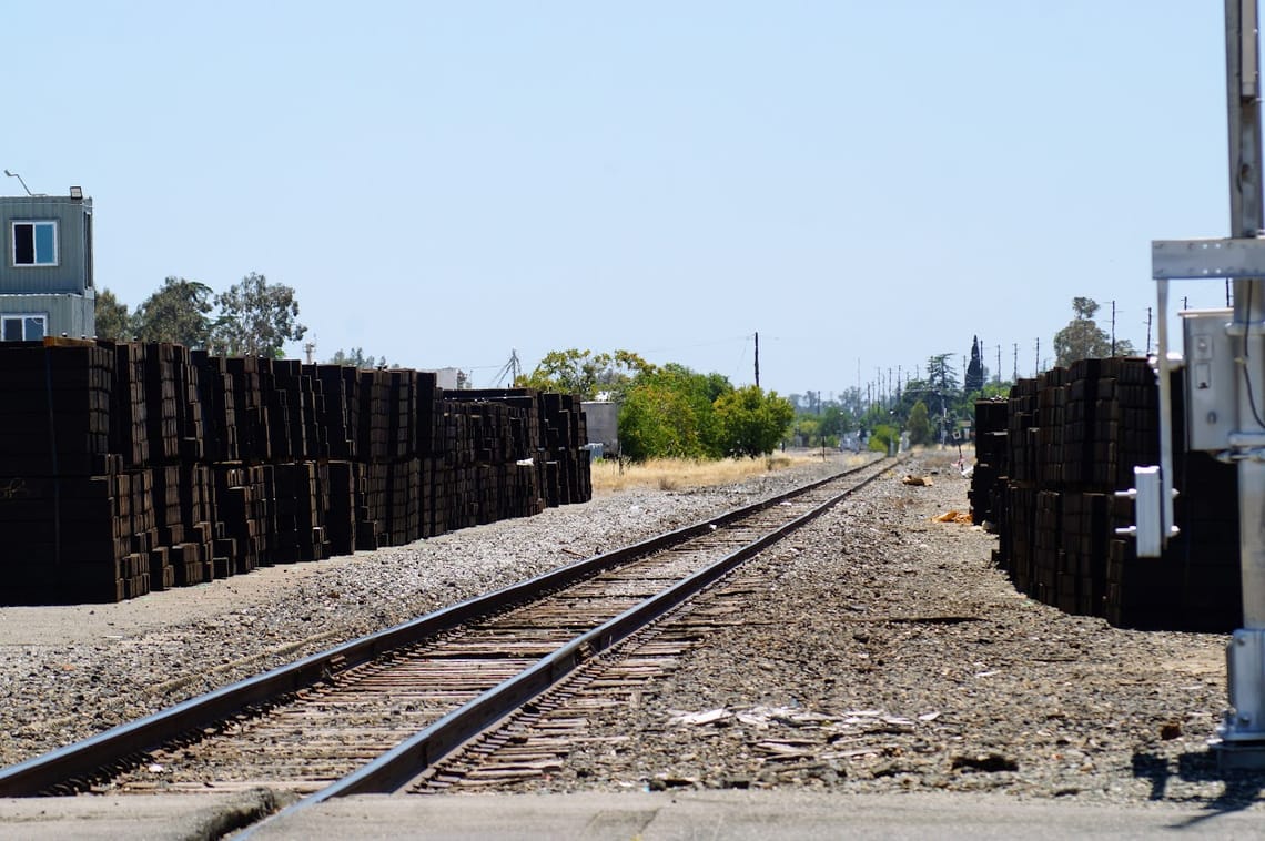 What’s up with all the railroad ties stacked by the tracks ...